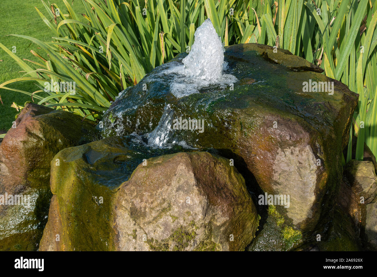 Large natural rock water feature Stock Photo - Alamy