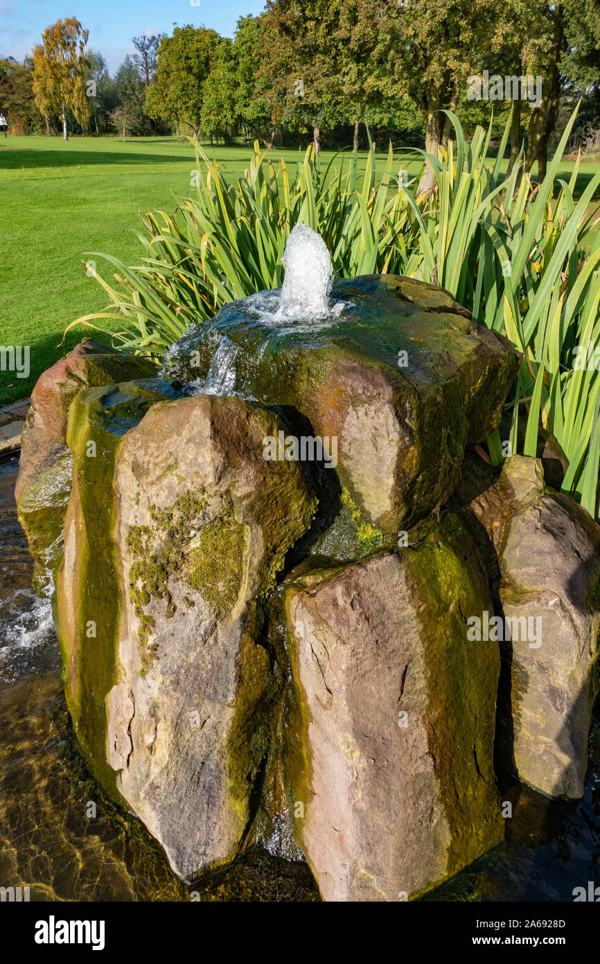 Large natural rock water feature Stock Photo - Alamy