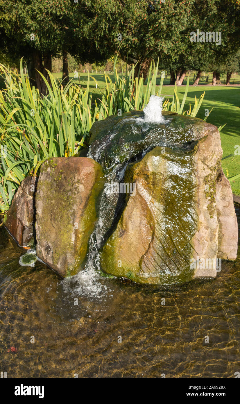 Large natural rock water feature Stock Photo - Alamy