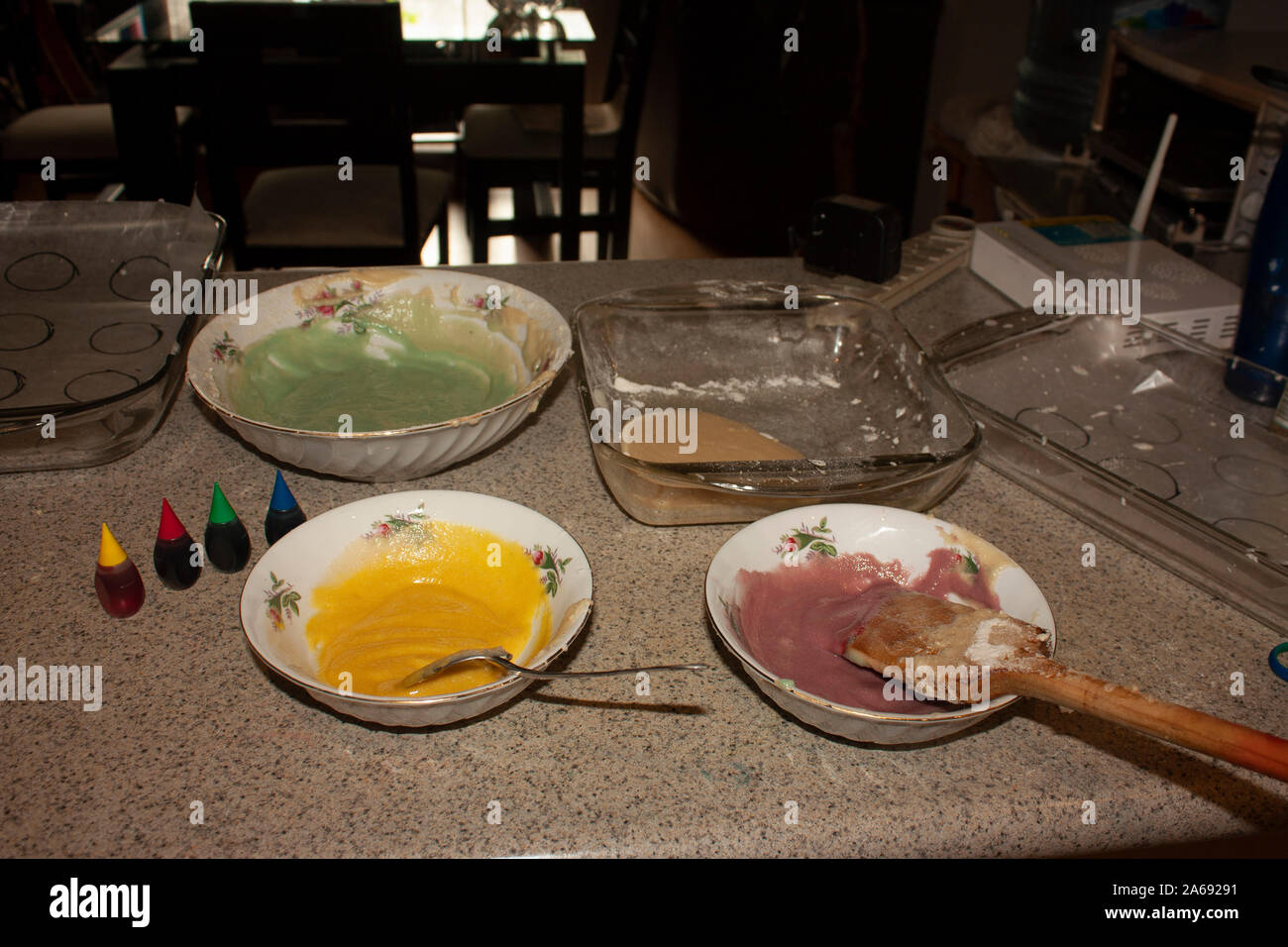 Natural, yellow, purple and blue macaroni paste separated in different ...