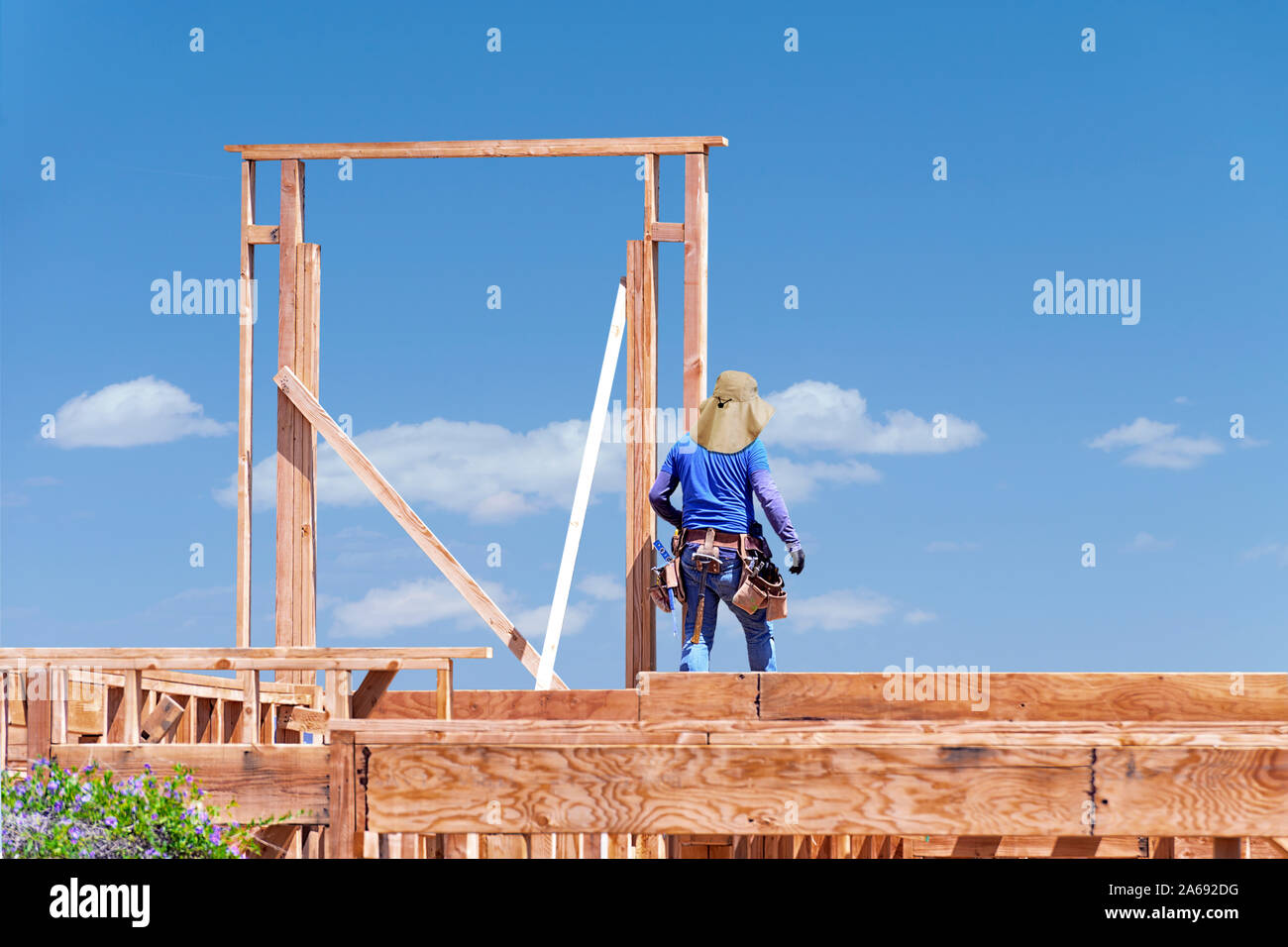 Construction worker building a two story residential house Stock Photo ...