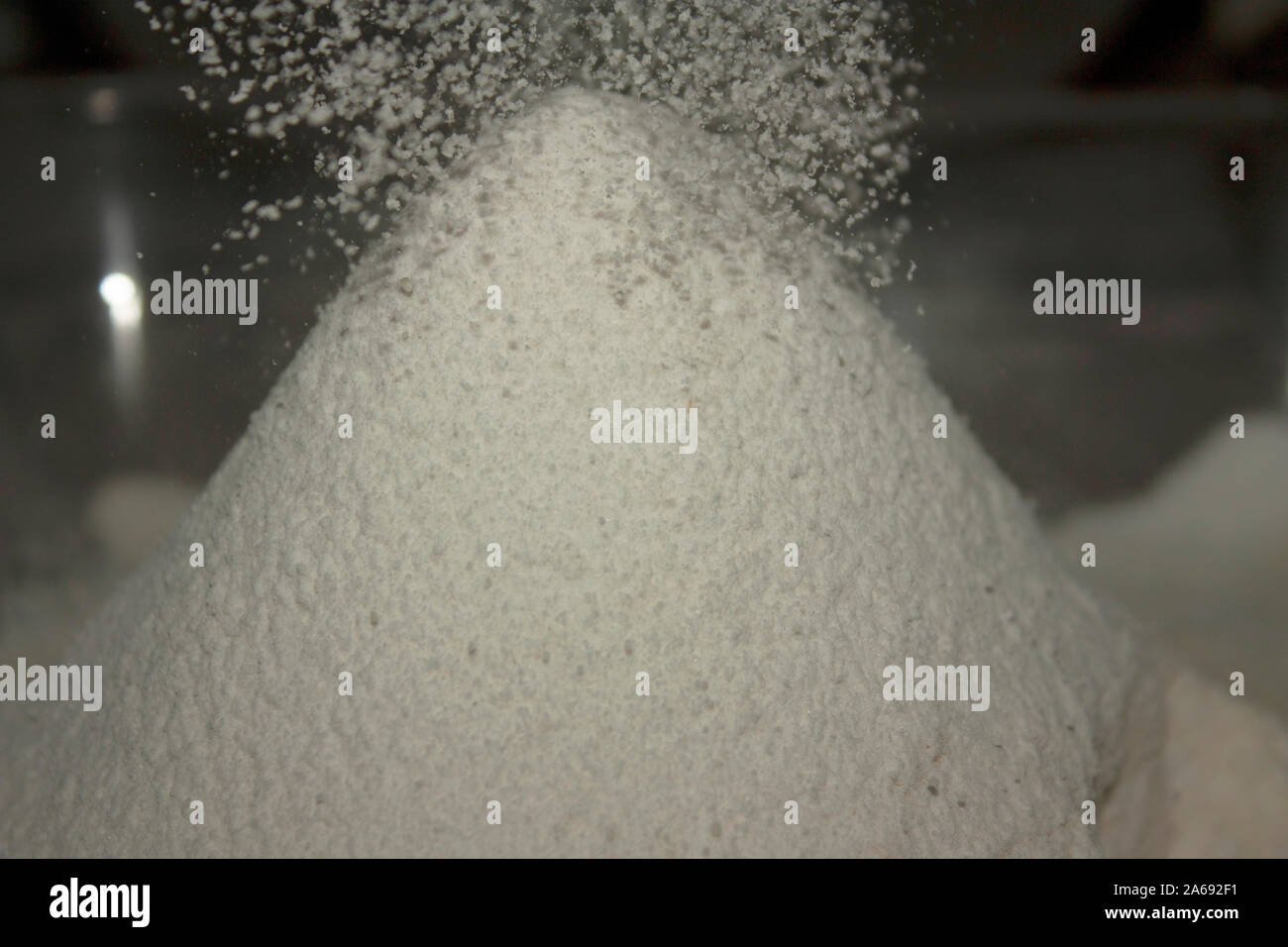 Cloud of icing sugar and sifted almond flour in the form of rain ...