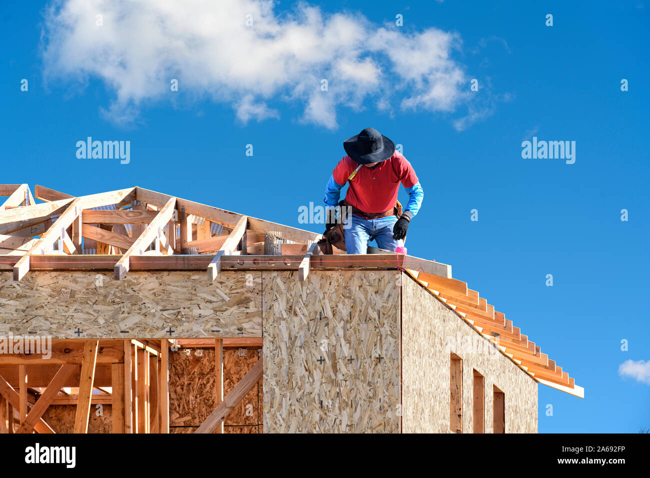 Construction worker building a two story residential house Stock Photo ...