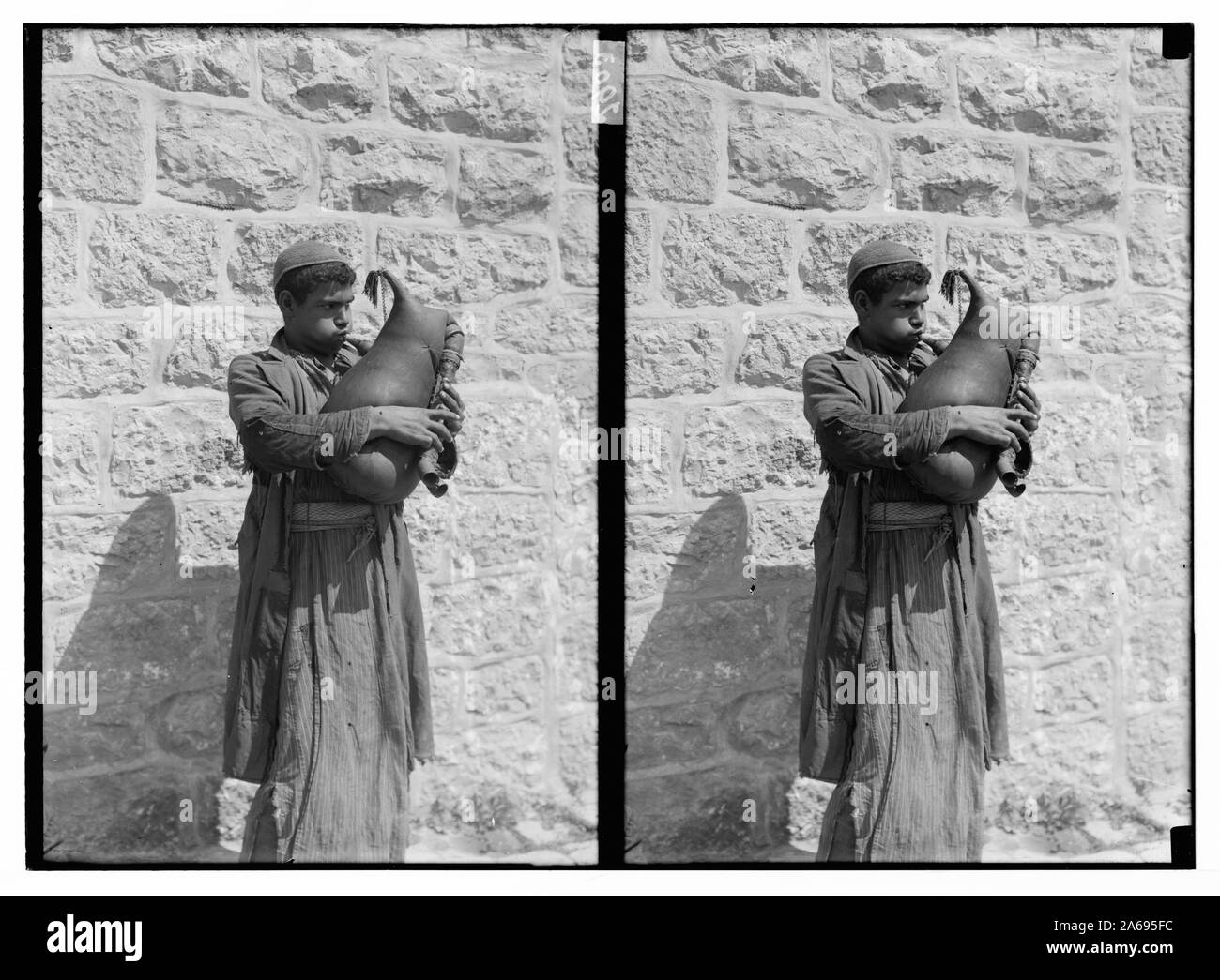 Young Bedouin man blowing (bagpipe) instrument Stock Photo - Alamy