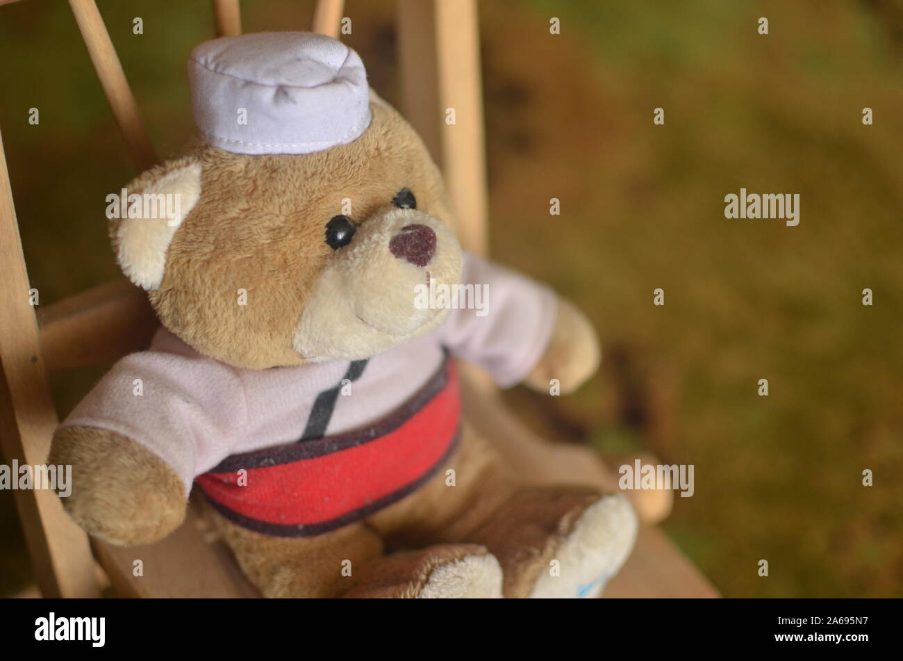 Baby teddy on chair hi-res stock photography and images - Alamy