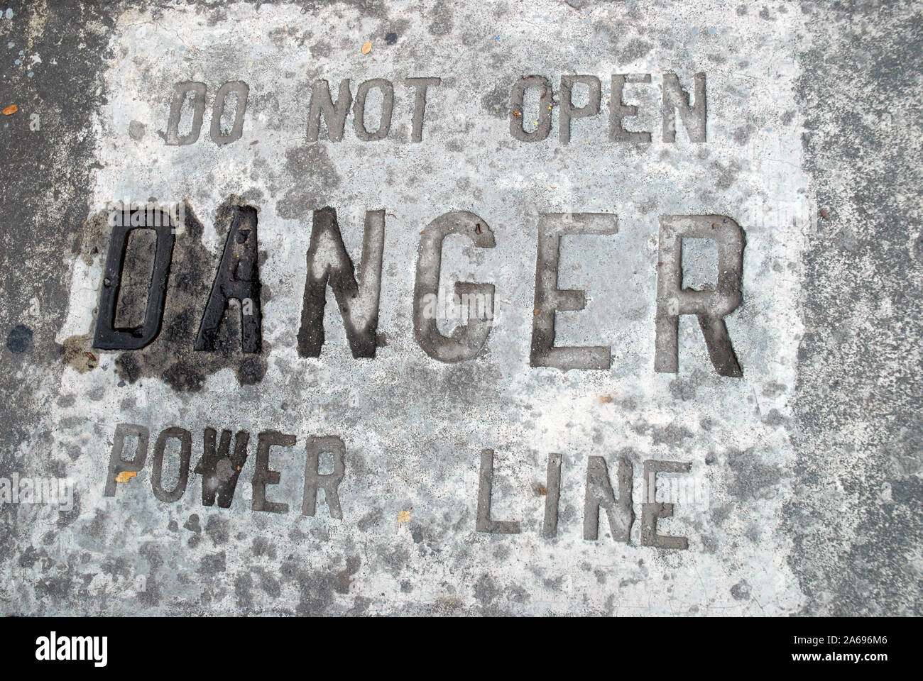 Danger Do Not Open Power Line Sign on pavement, Pasay, Manila ...