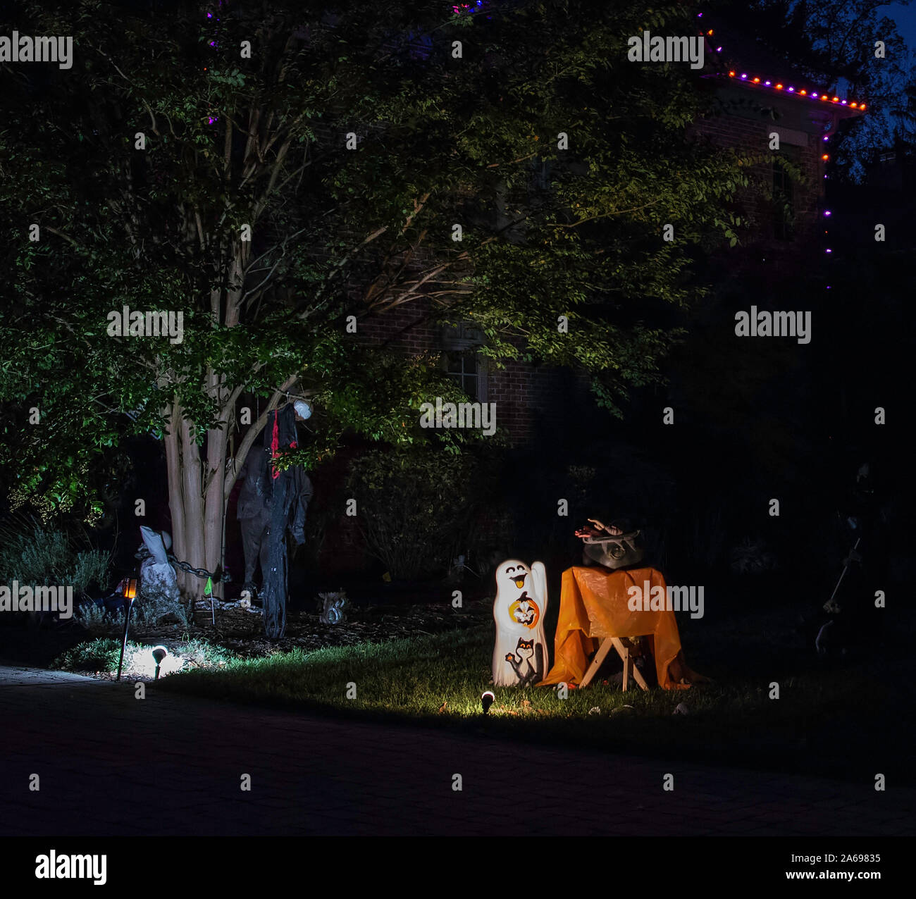 Suburban Halloween decorations at night Stock Photo - Alamy