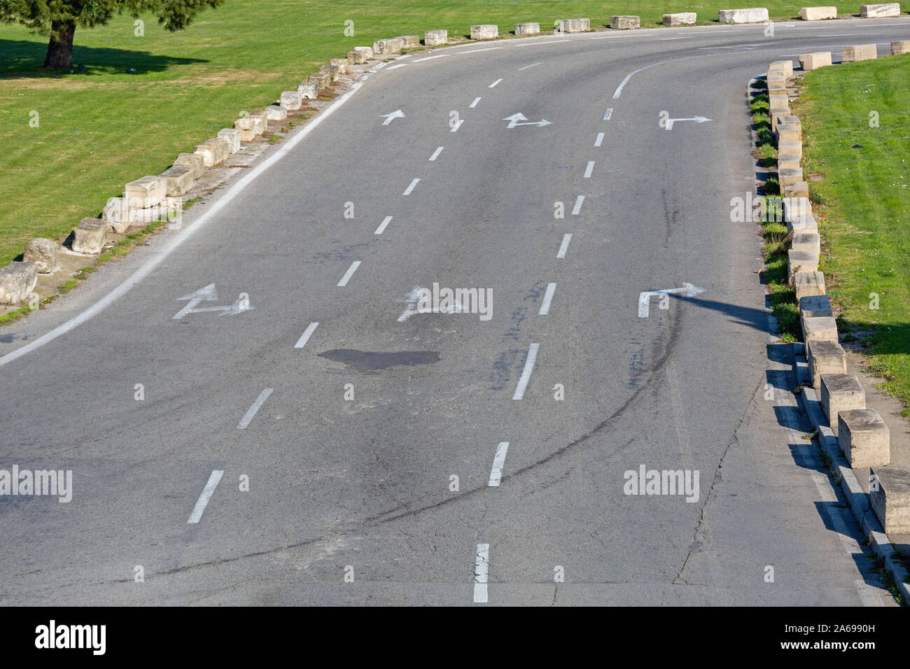 Empty Three Lanes Street With Arrows Sunny Day Stock Photo - Alamy