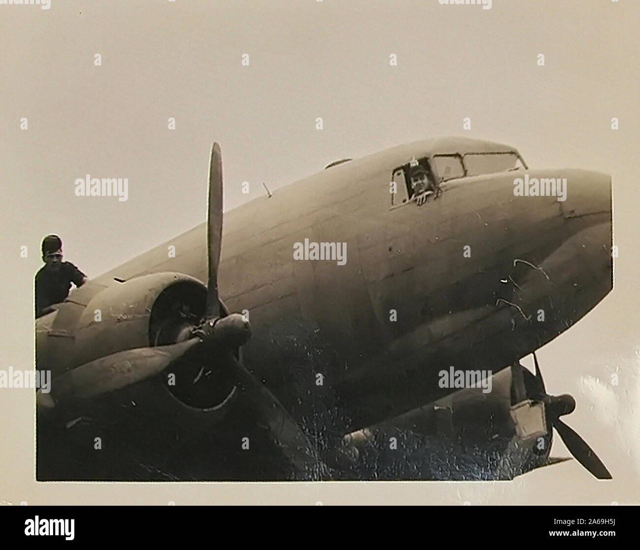 Vintage photo of a WWII C-47 cargo plane with posing pilot and mechanic ...