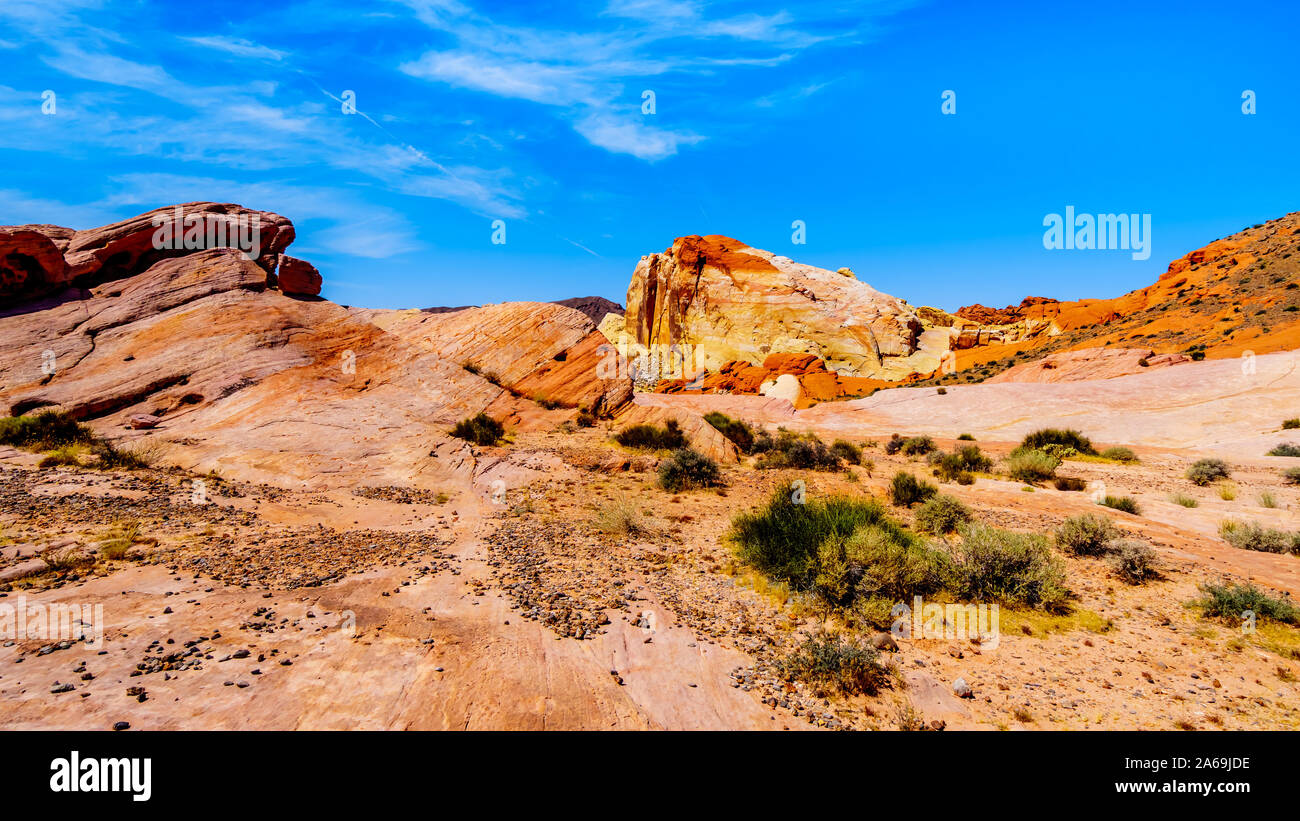 The colorful red, yellow and white banded rock formations along the ...