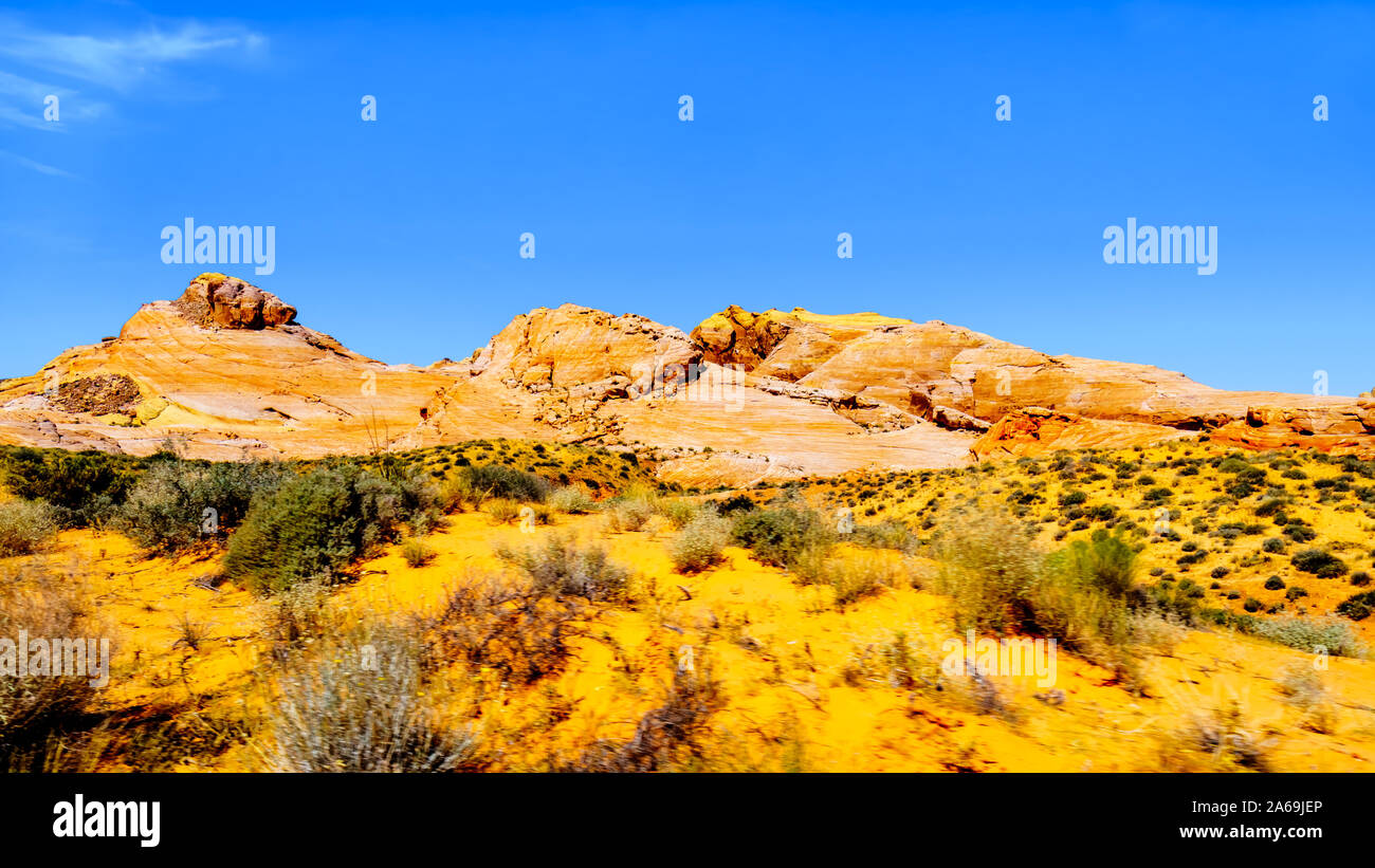 The colorful red, yellow and white banded rock formations along the ...