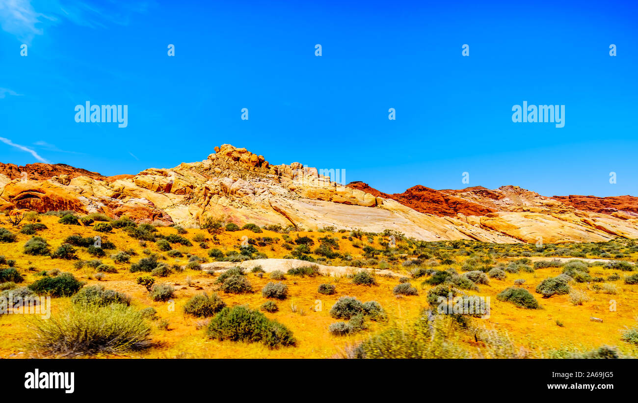The colorful red, yellow and white banded rock formations along the ...