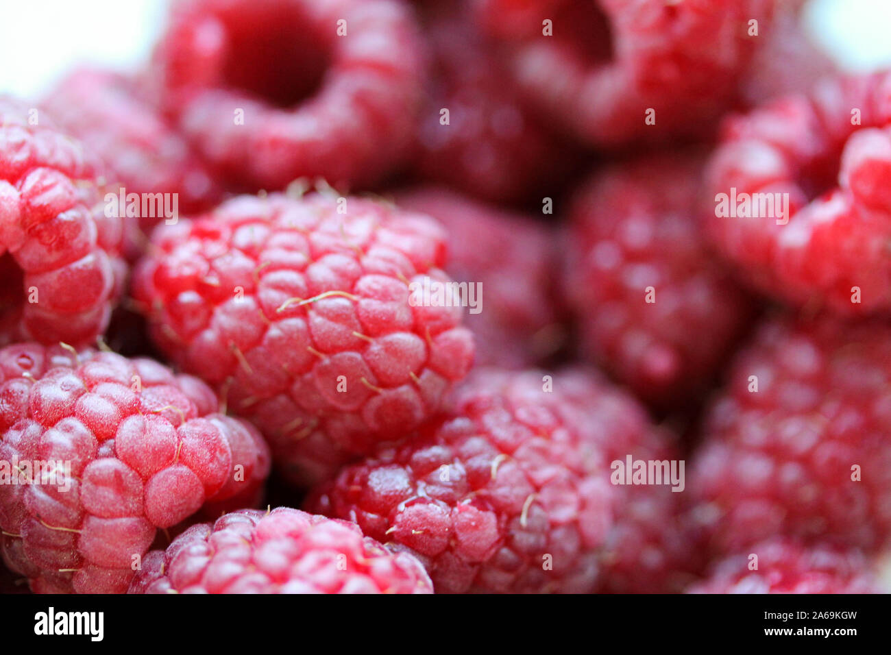 Background with fresh raspberry closeup. Raspberry macro photography ...