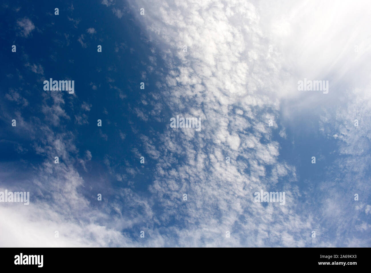 High white wispy cirrus clouds with cirro-stratus in the blue ...