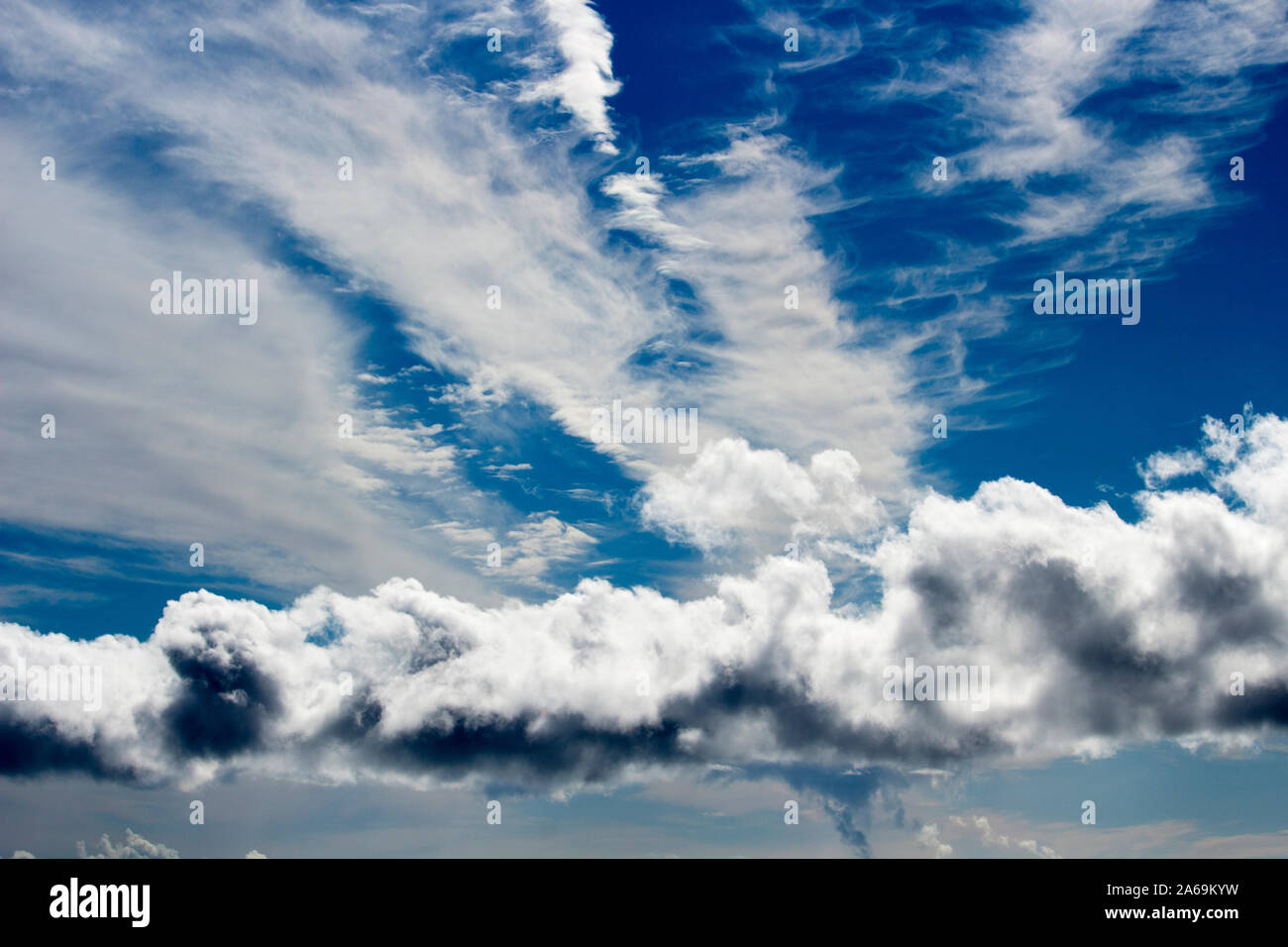 High white wispy cirrus clouds with cirro-stratus in the blue ...
