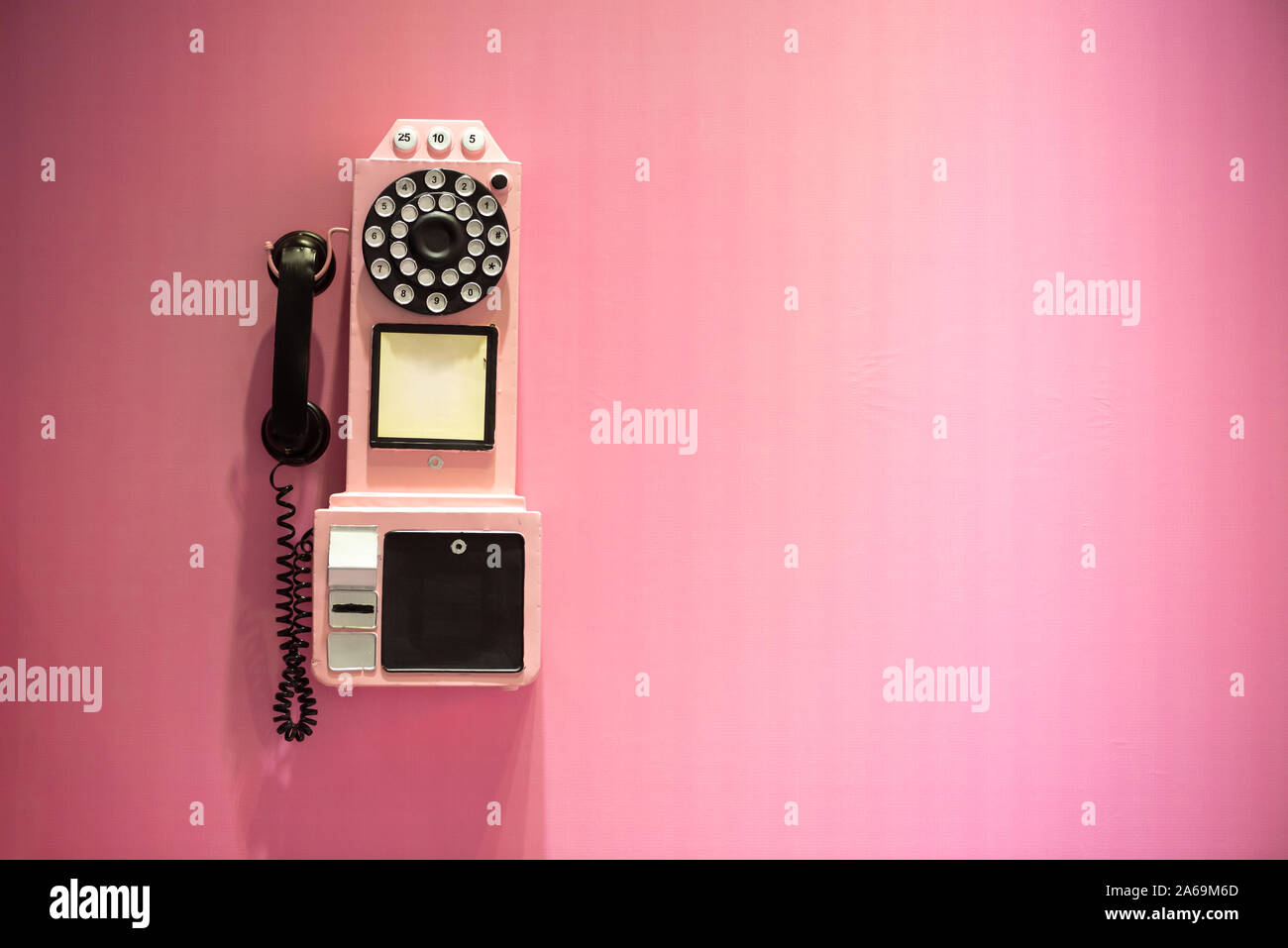 Vintage telephone hanging on the wall hi-res stock photography and ...