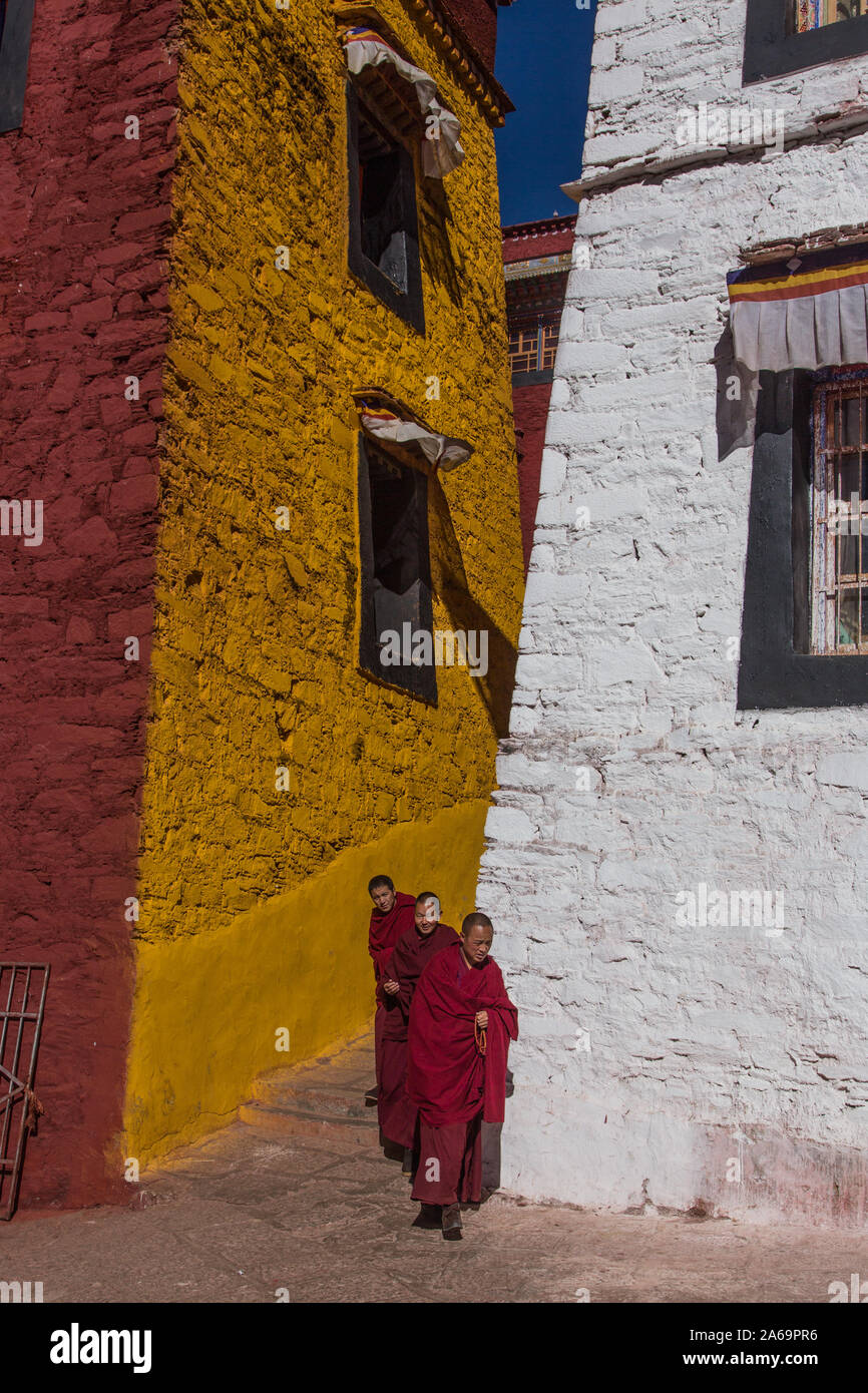 Three buddhist monks walking hi-res stock photography and images - Alamy