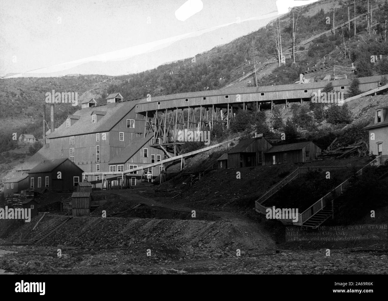Large mill; five smaller buildings in foreground Stock Photo - Alamy