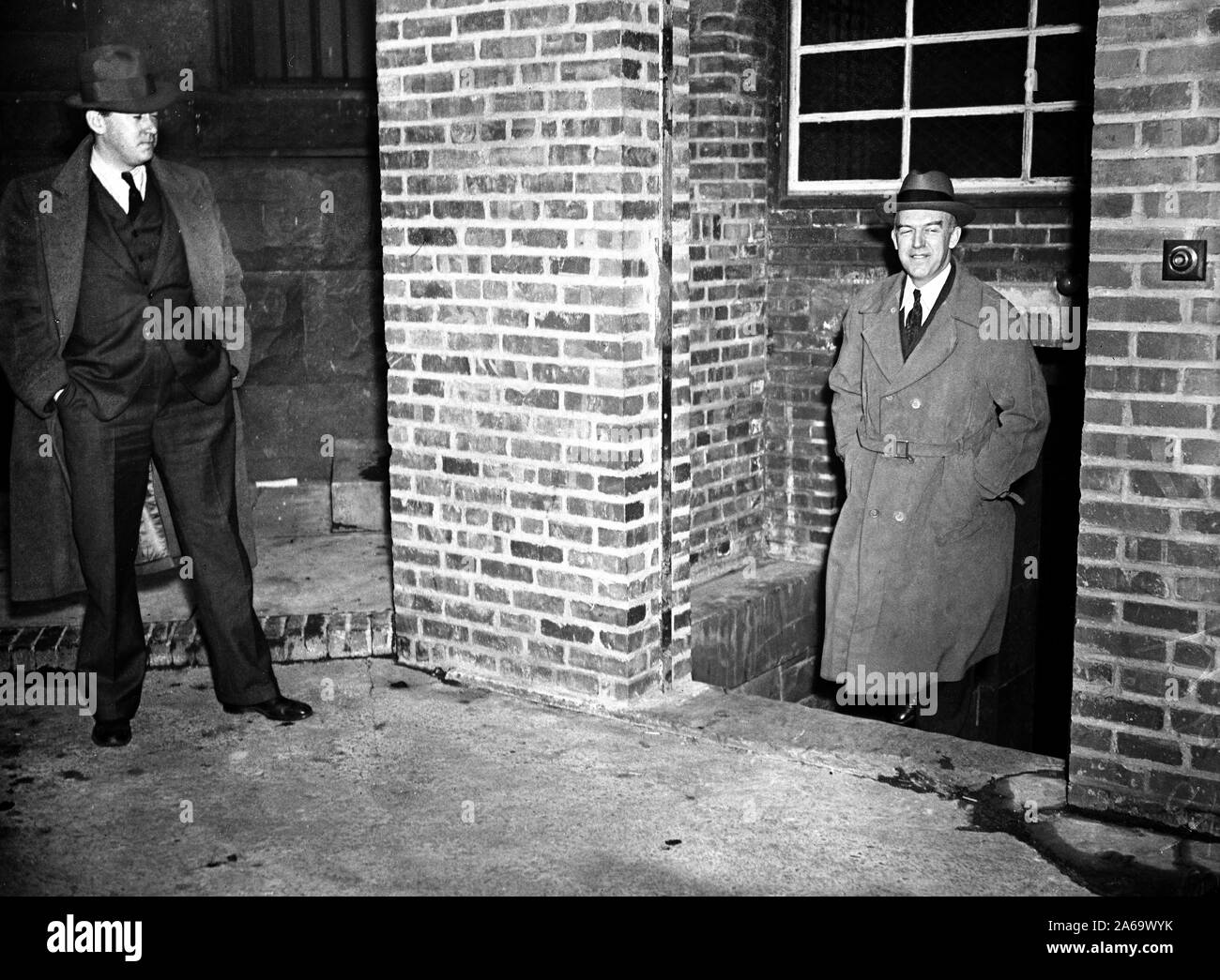 Two men wearing trench coats hi-res stock photography and images - Alamy