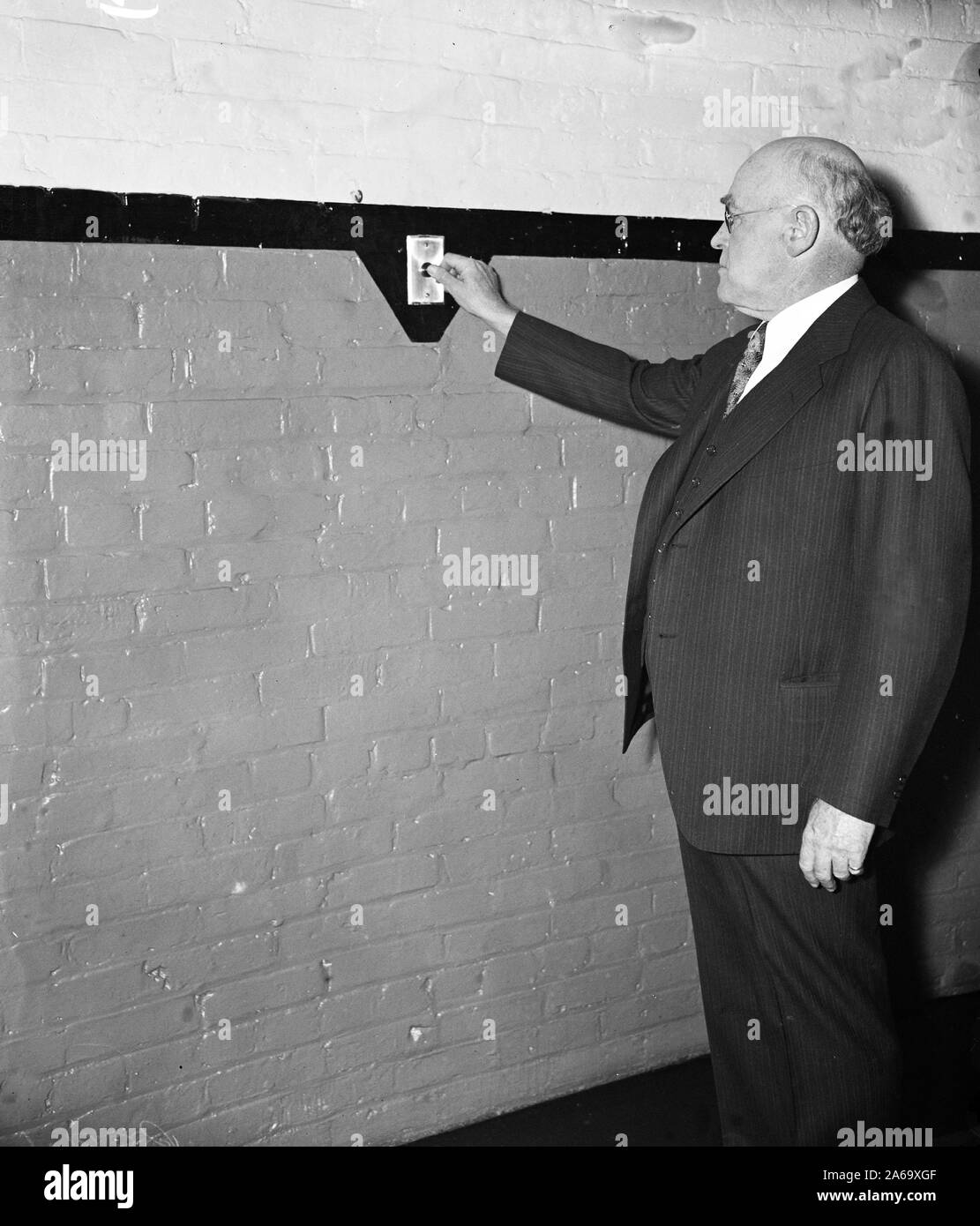 Man pushing a button ca. 1936 Stock Photo - Alamy