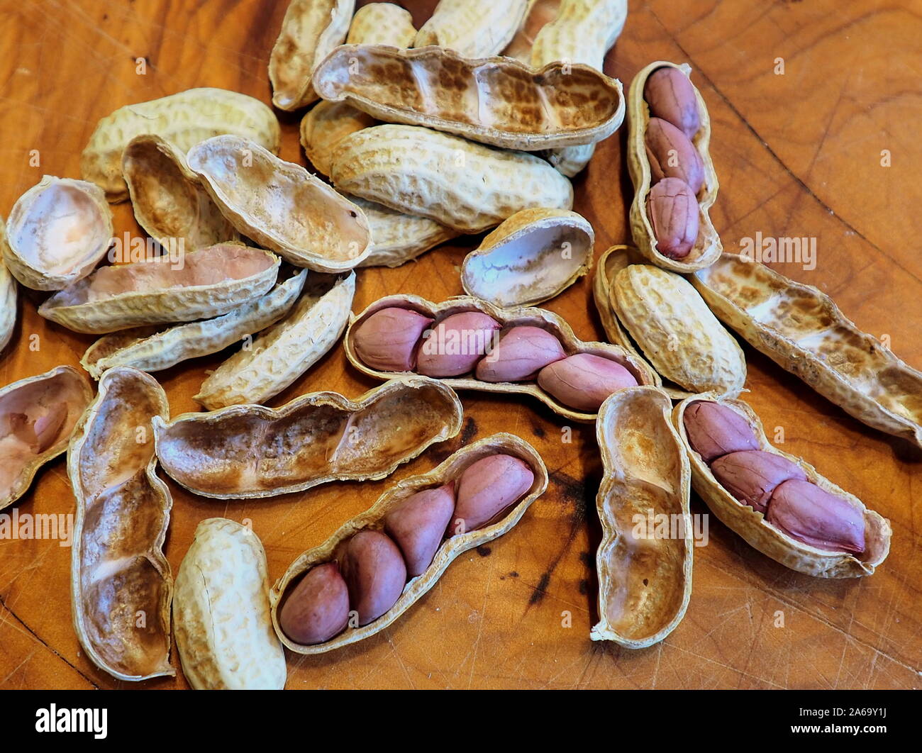 Groups of four and three peanuts in shells hi-res stock photography and ...