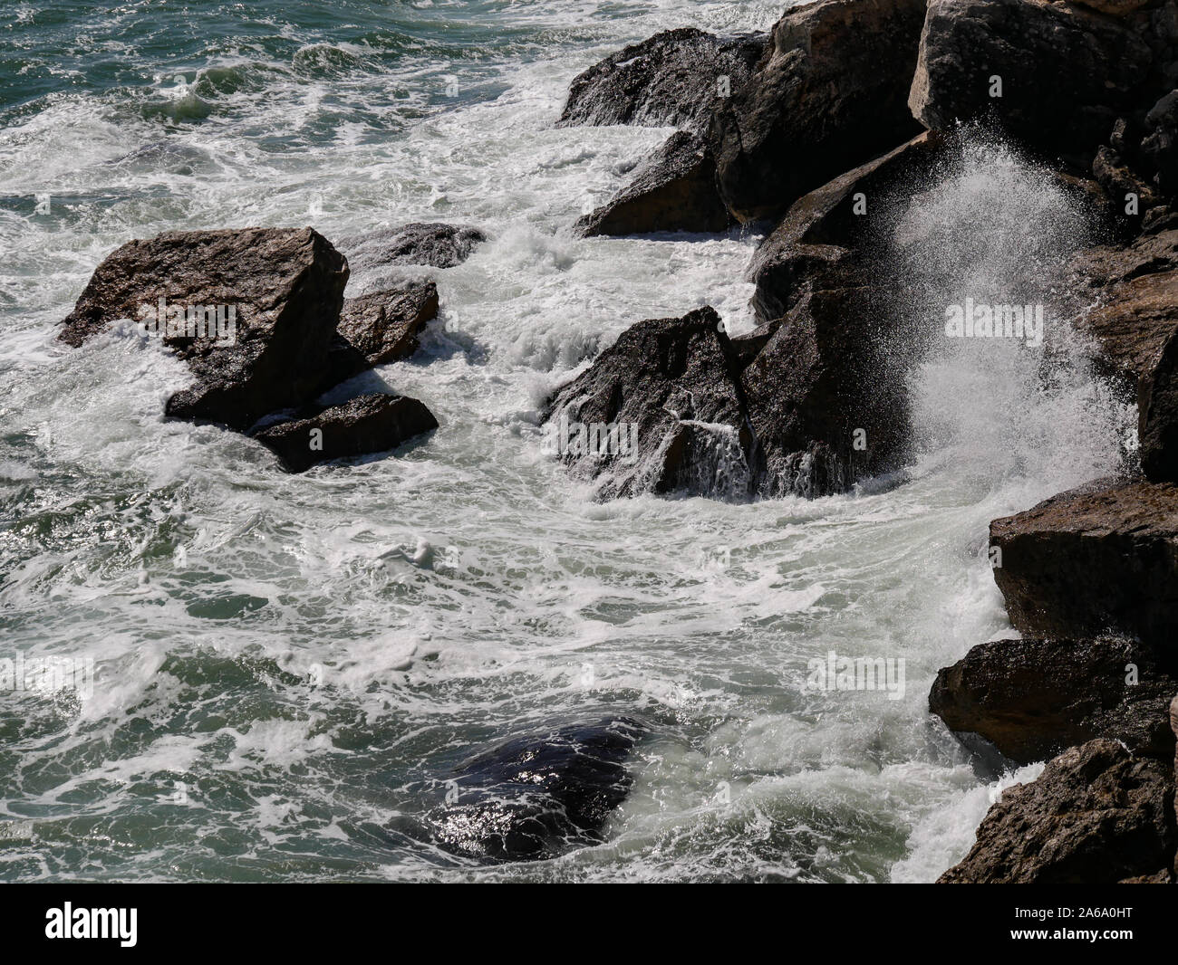 Sea waves are breaking in the rocks. The sea is stormy and gloomy Stock ...