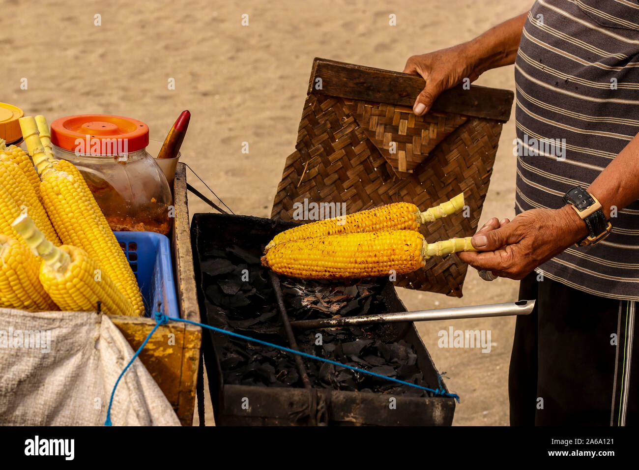 Baked corn sold on the beach in Bali island, Indonesia Stock Photo - Alamy