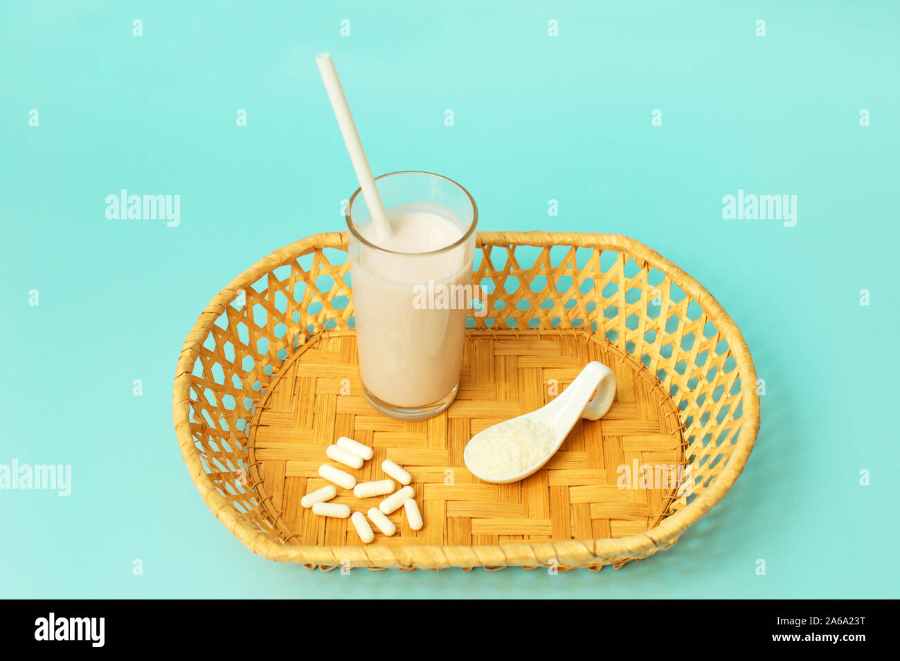 Collagen powder, milk and pills on blue background. Extra protein ...