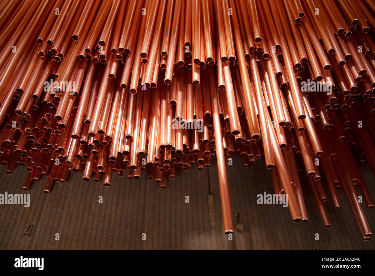 Copper pipes in factory, industrial background Stock Photo - Alamy