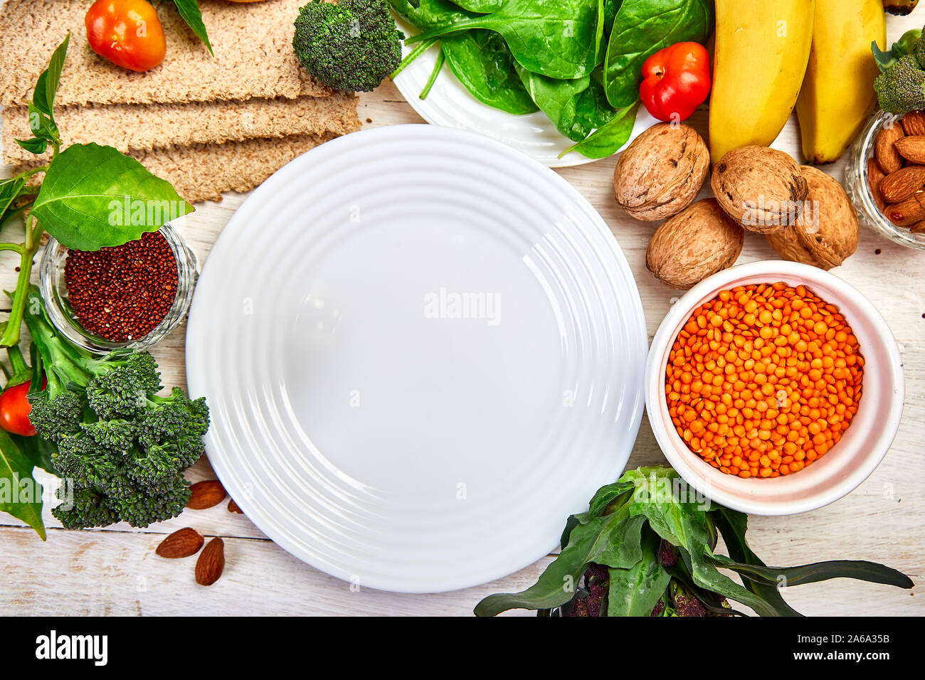 Selection food rich in fiber on white wooden background around empty ...