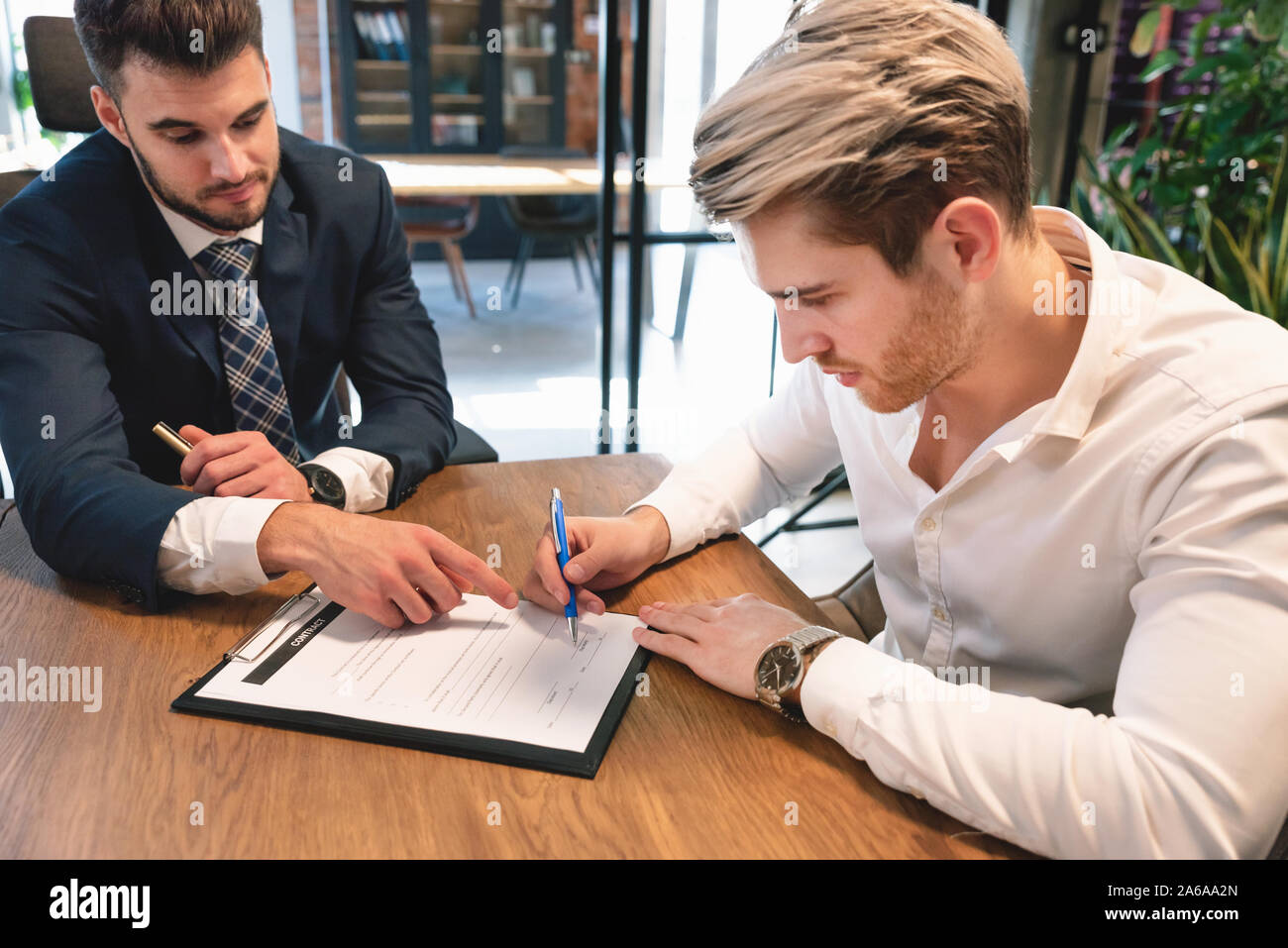 Man signs agreement contract at the office. Business contract, legal ...