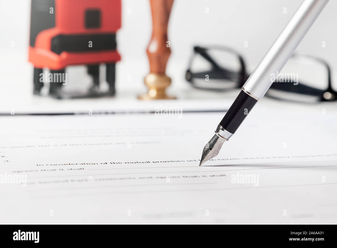 Notary signs legal contract. Close up of fountain pen on paper Stock ...