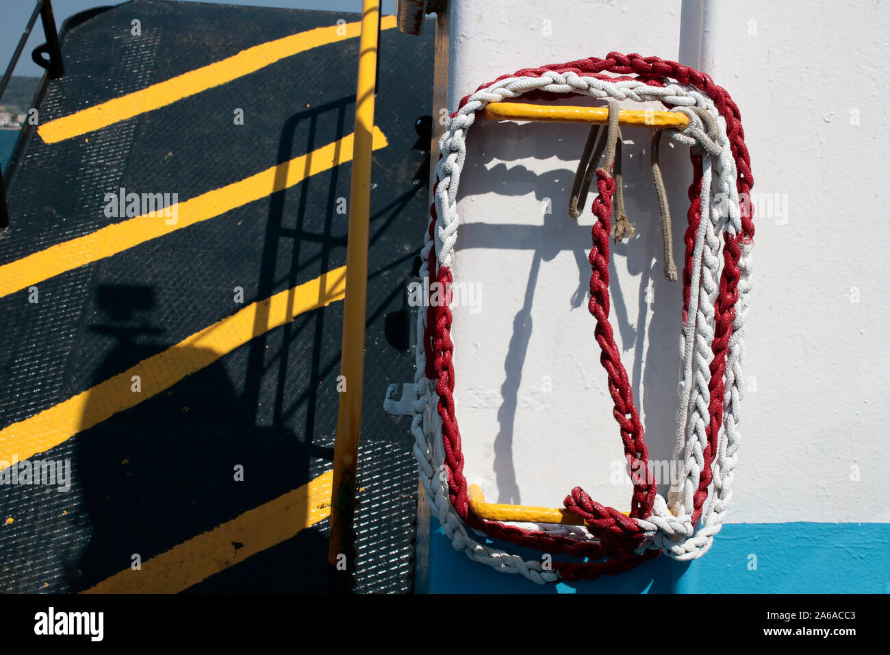 Rope wrapped in red white color on ferry Stock Photo - Alamy