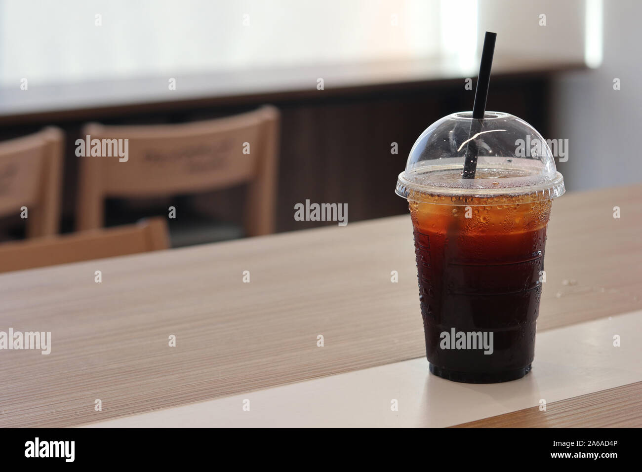 Iced coffee in plastic cup with coffee beans hi-res stock photography ...