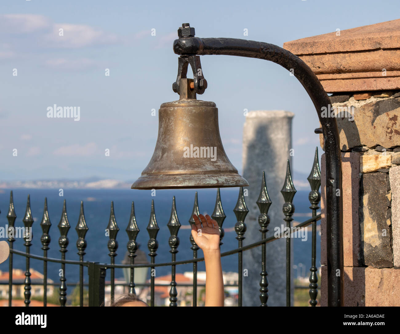 Bells hanging out of the door. Hand reaches out to steal Stock Photo ...