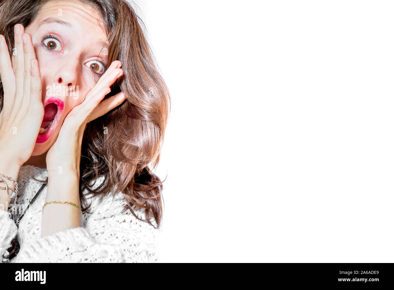 The scream: Portrait of a terrified young girl on a white background ...