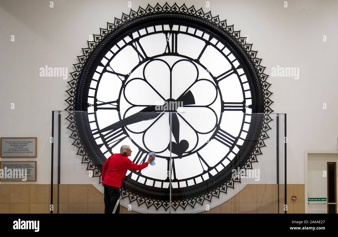 Dougie Cook, from the housekeeping team, cleans the St Enoch Clock in ...