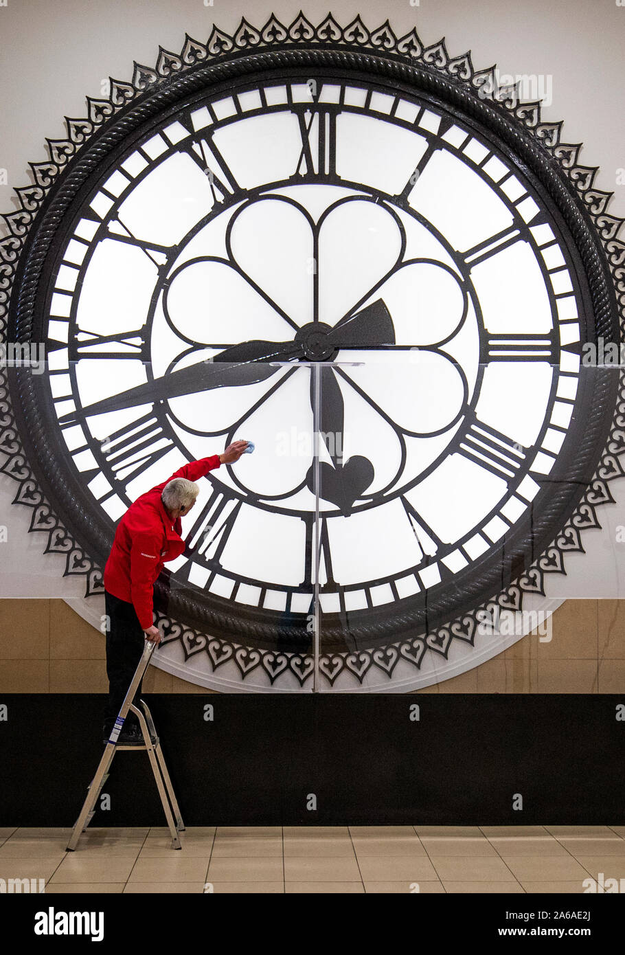 Dougie Cook, from the housekeeping team, cleans the St Enoch Clock in ...