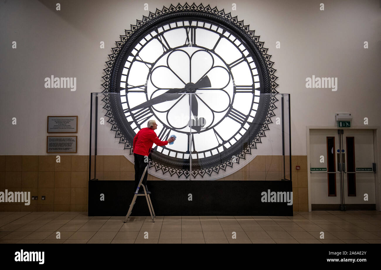 Dougie Cook, from the housekeeping team, cleans the St Enoch Clock in ...