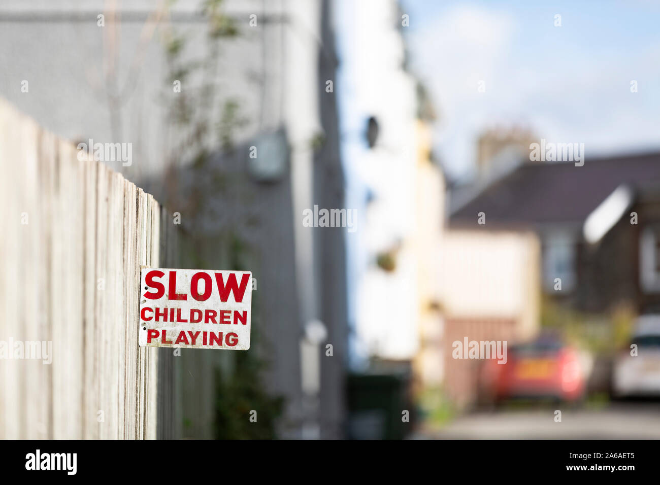 A Slow - Children Playing sign in a street in a residential area ...