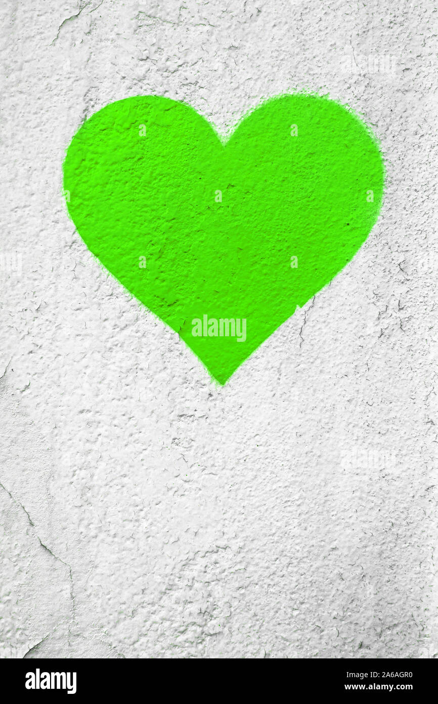 Green love heart hand drawn on grungy wall. Textured background trendy ...