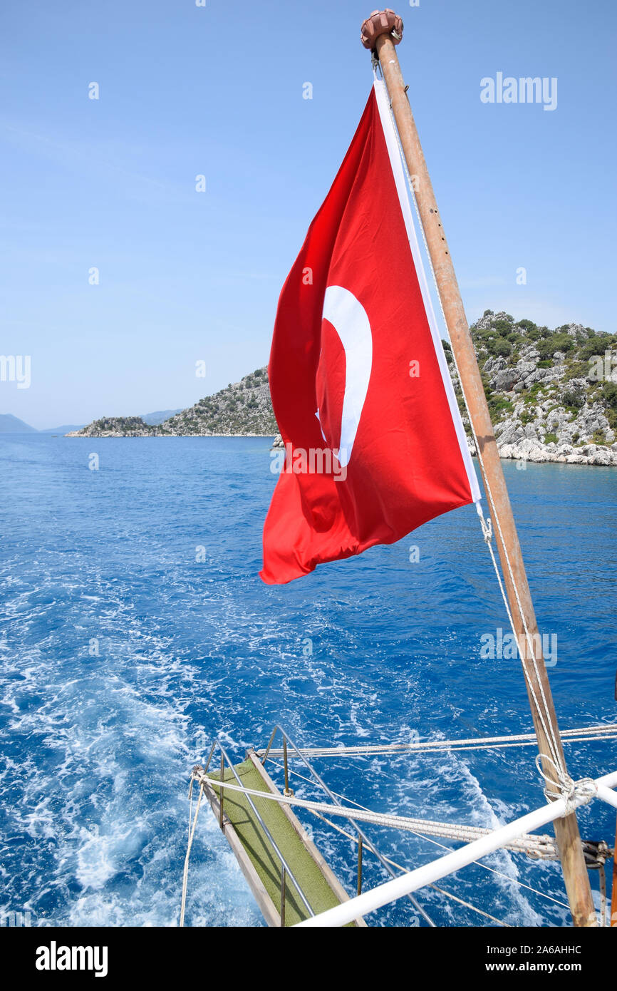 Turkey flag at the stern of a pleasure yacht. View of the Mediterranean ...