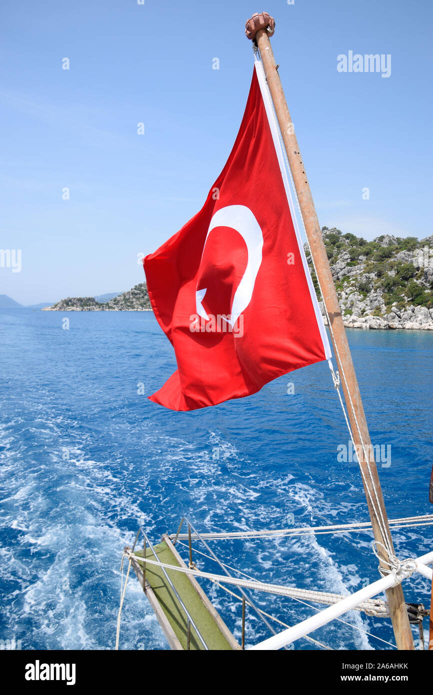 Turkey flag at the stern of a pleasure yacht. View of the Mediterranean ...