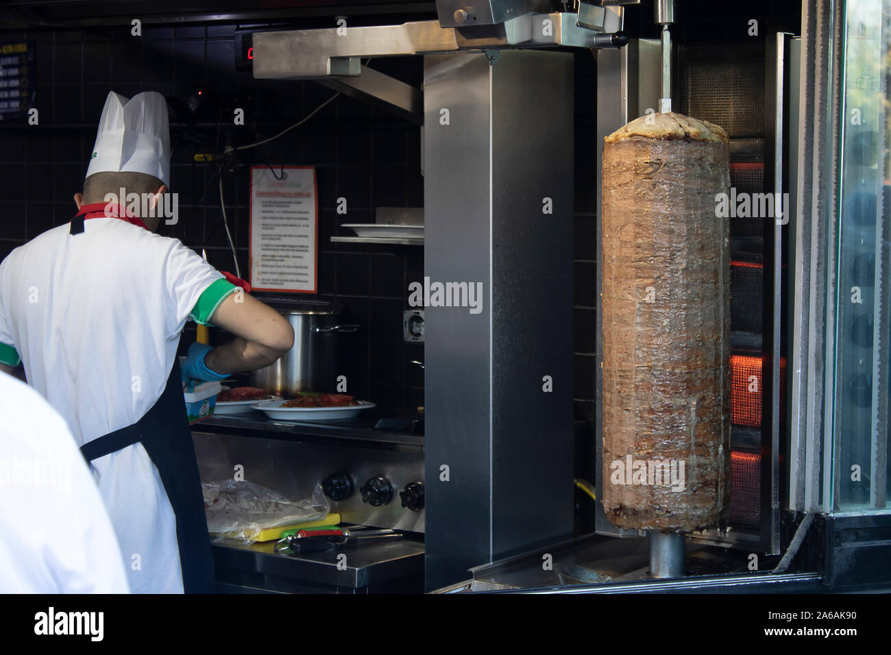 Chicken and meat doner close-up. Rotary machine close-up. Cut meats ...