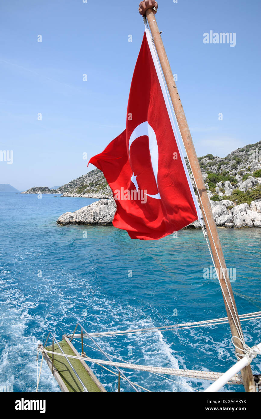 Turkey flag at the stern of a pleasure yacht. View of the Mediterranean ...