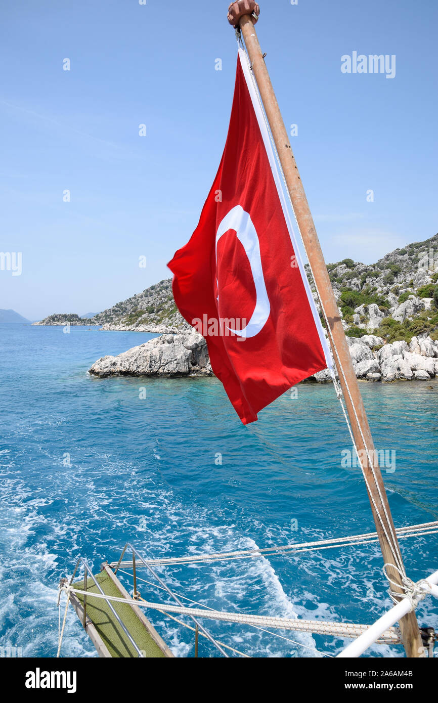 Turkey flag at the stern of a pleasure yacht. View of the Mediterranean ...