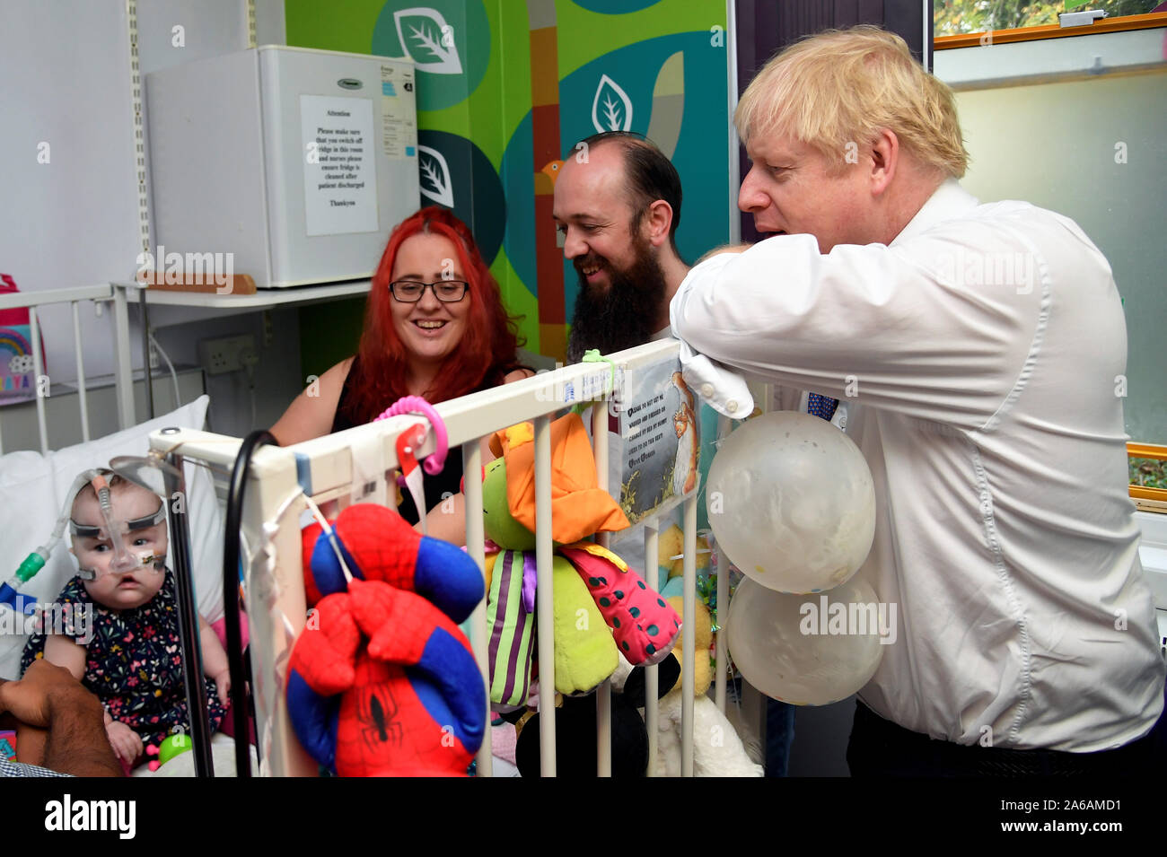 Prime Minister Boris Johnson meets one-year-old patient, Loraya, and ...