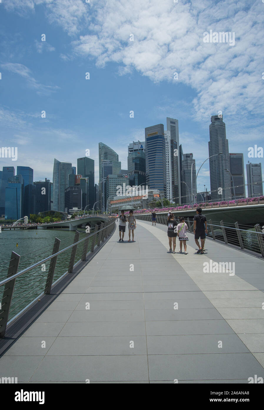People walking around in a beautiful day at the Marina bay in Singapore ...