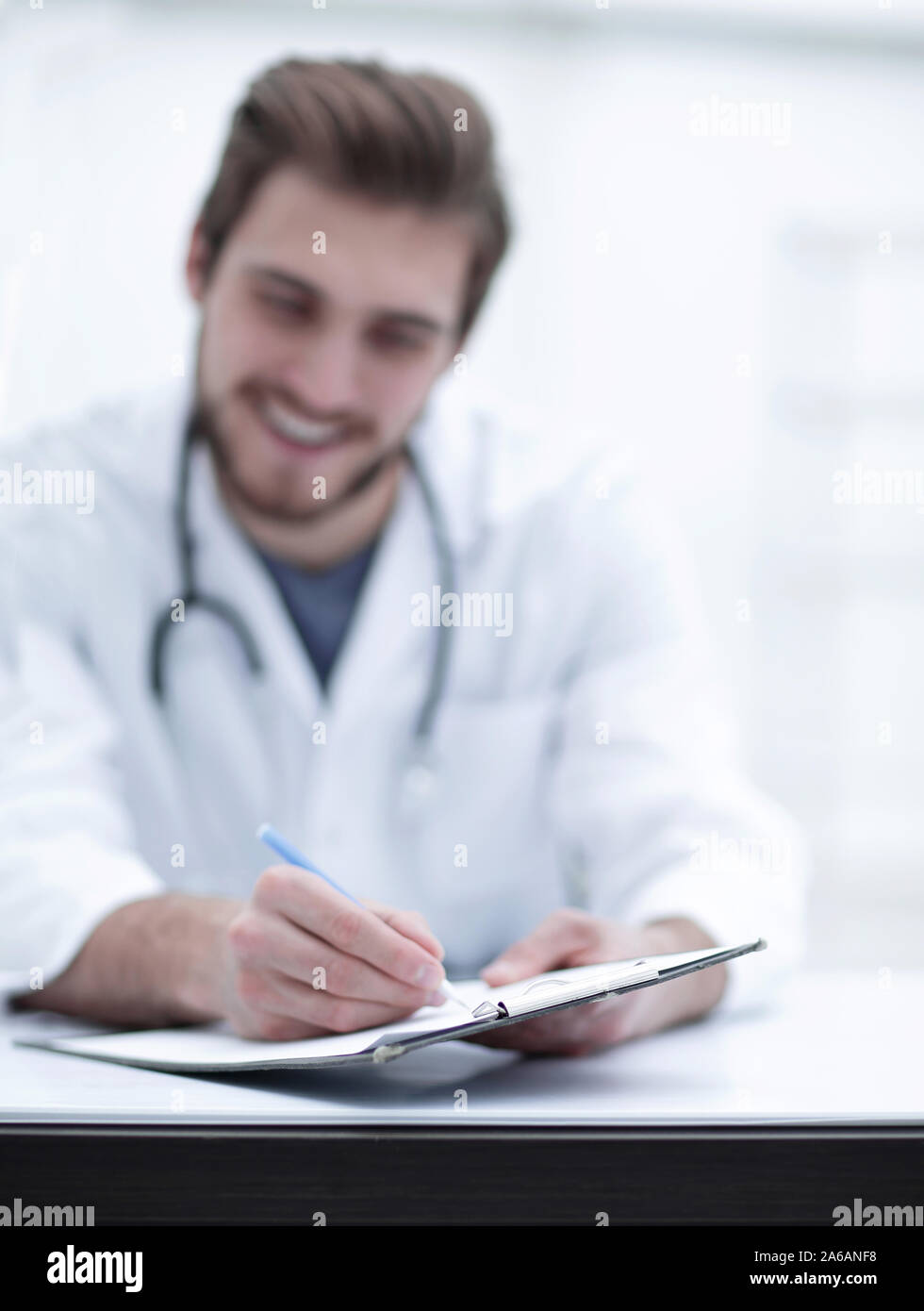Doctor writing out medical recipe hi-res stock photography and images ...