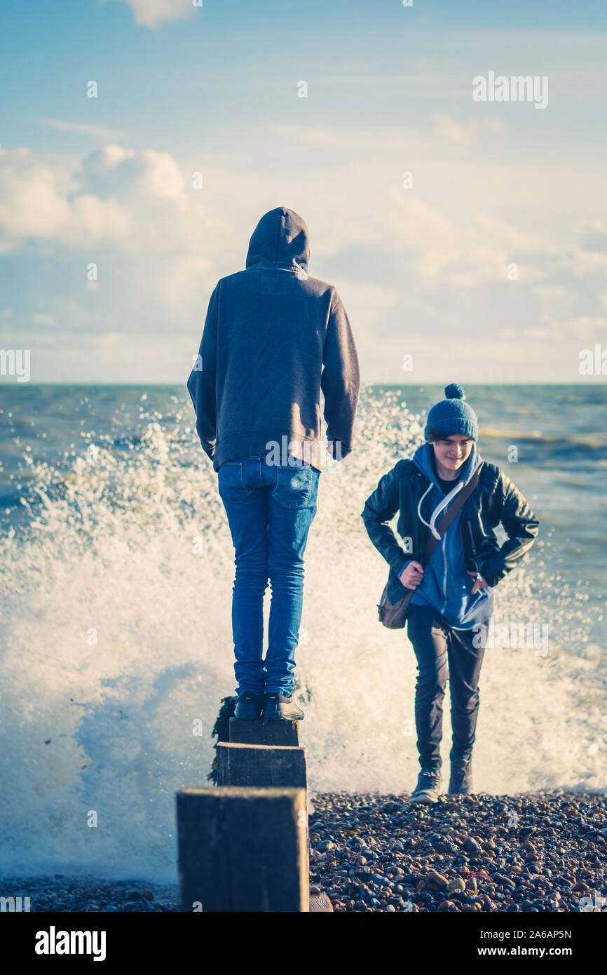 Teenage Boys having fun on Brighton Beach Stock Photo - Alamy